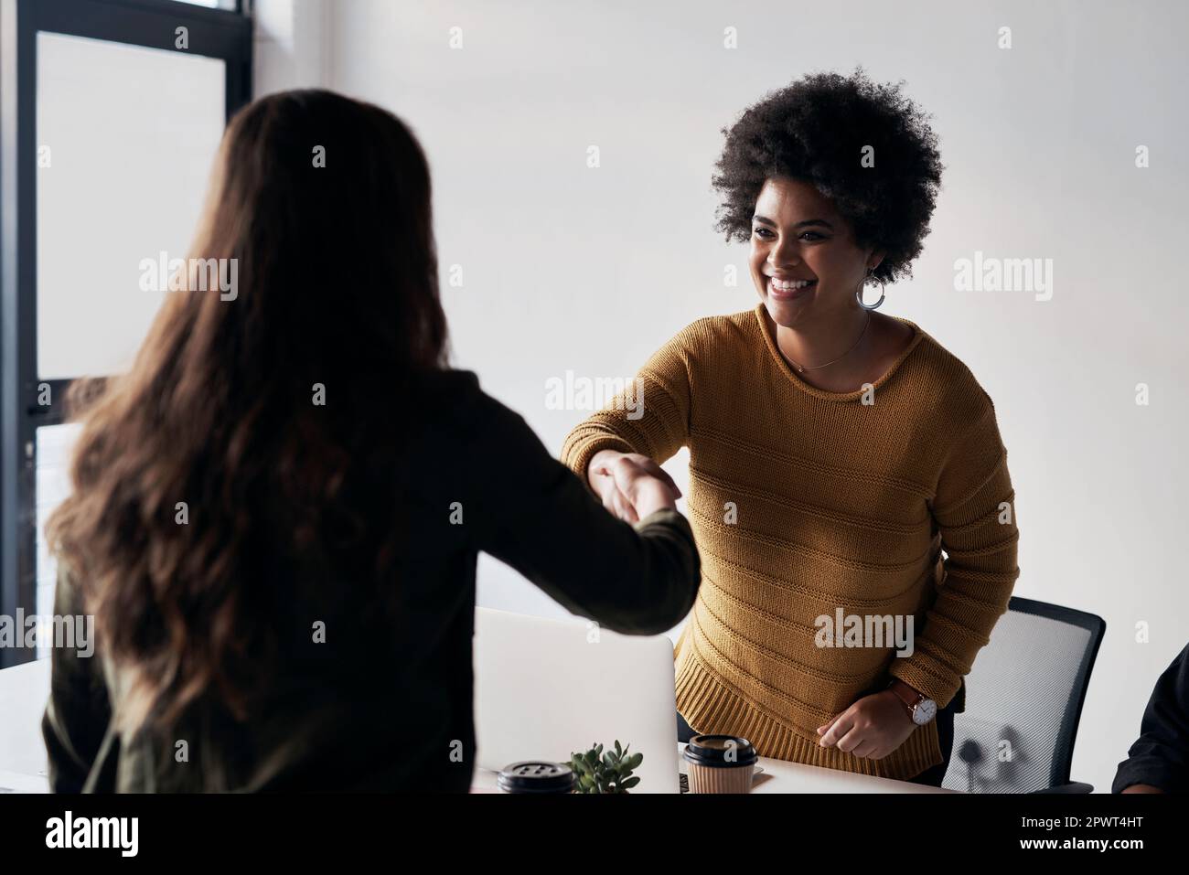 We cannot wait to start working with you. two young businesswomen ...