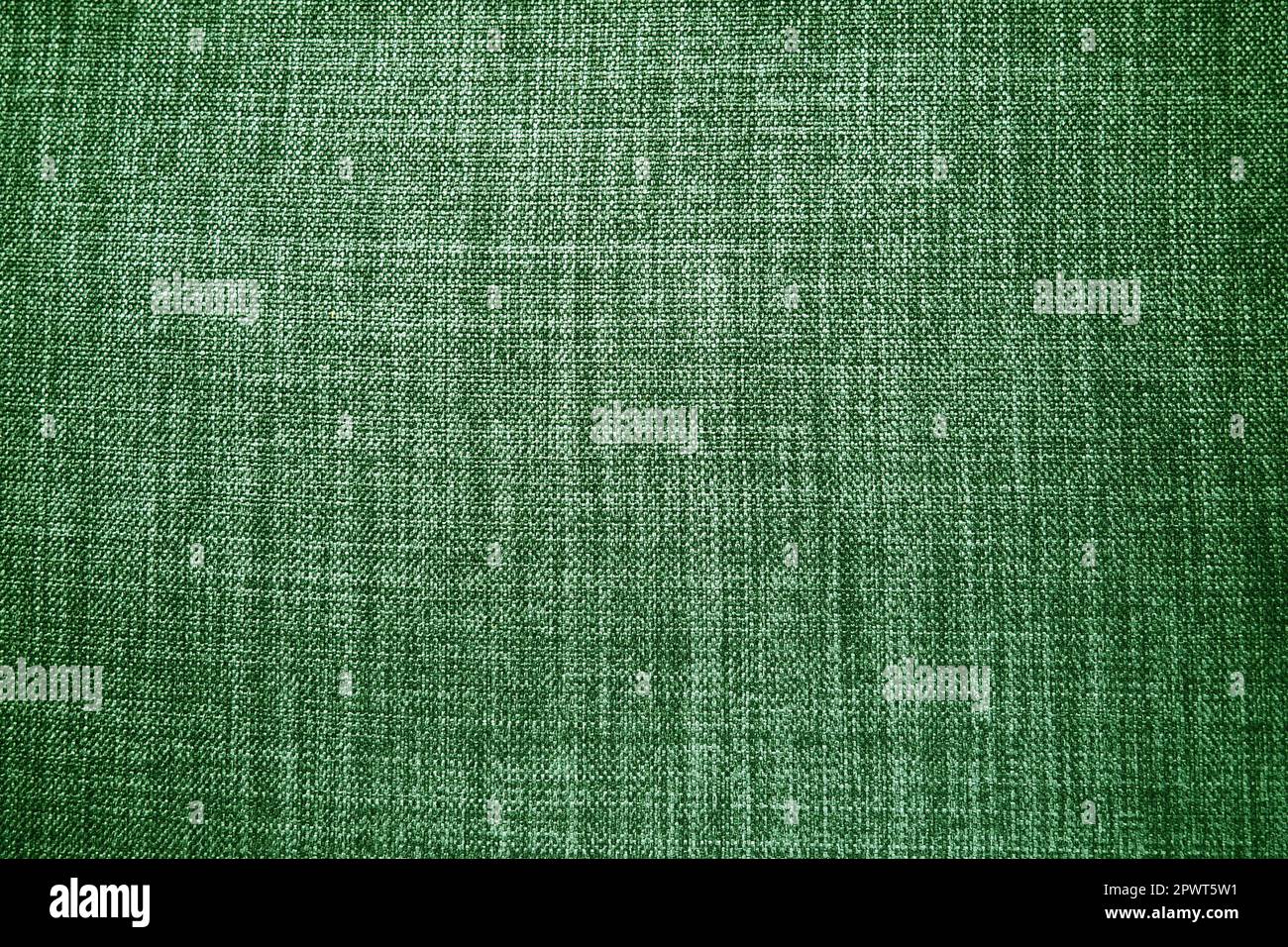 green background fabric texture. A piece of woolen cloth is neatly laid ...