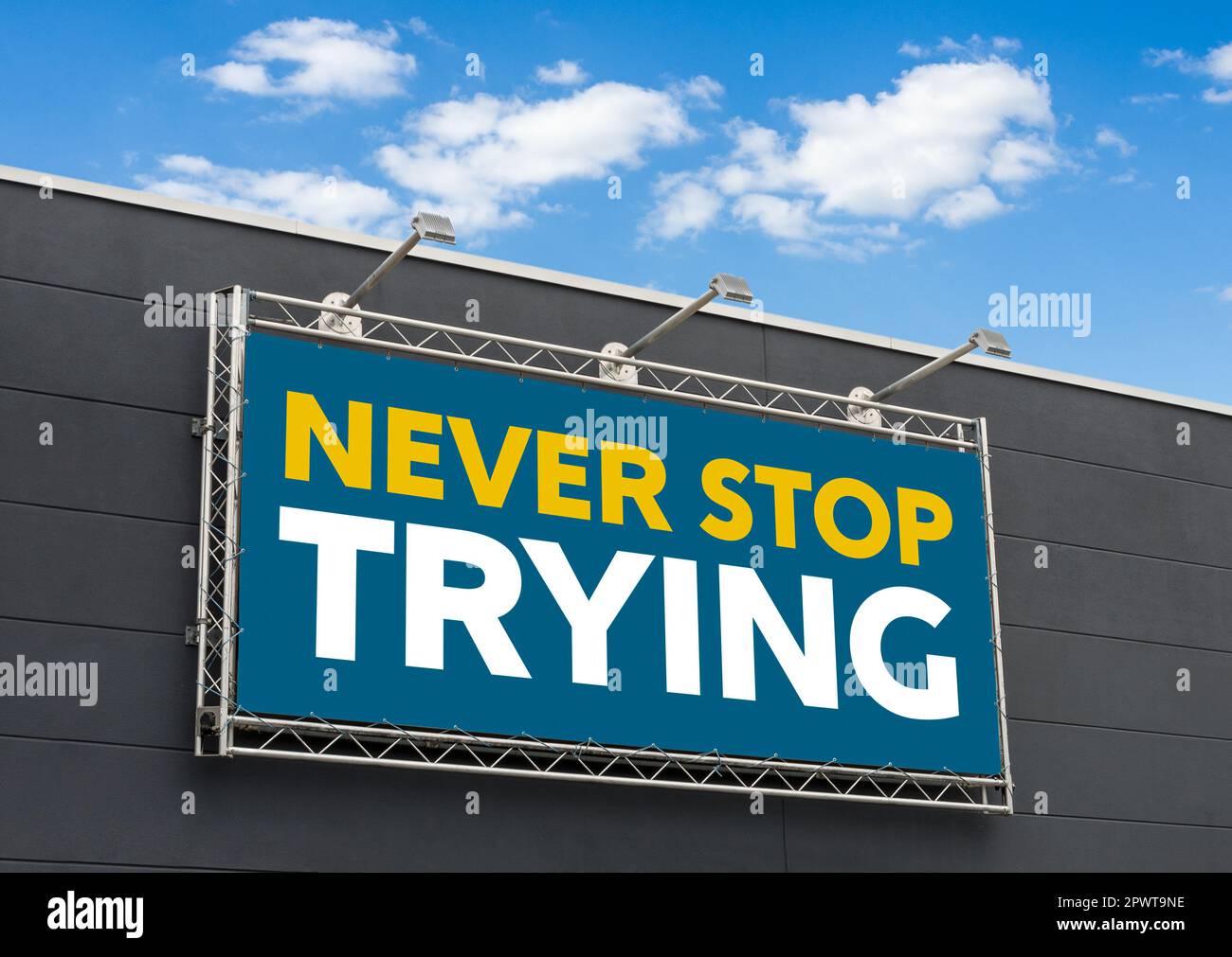 Never stop trying written on a billboard Stock Photo - Alamy