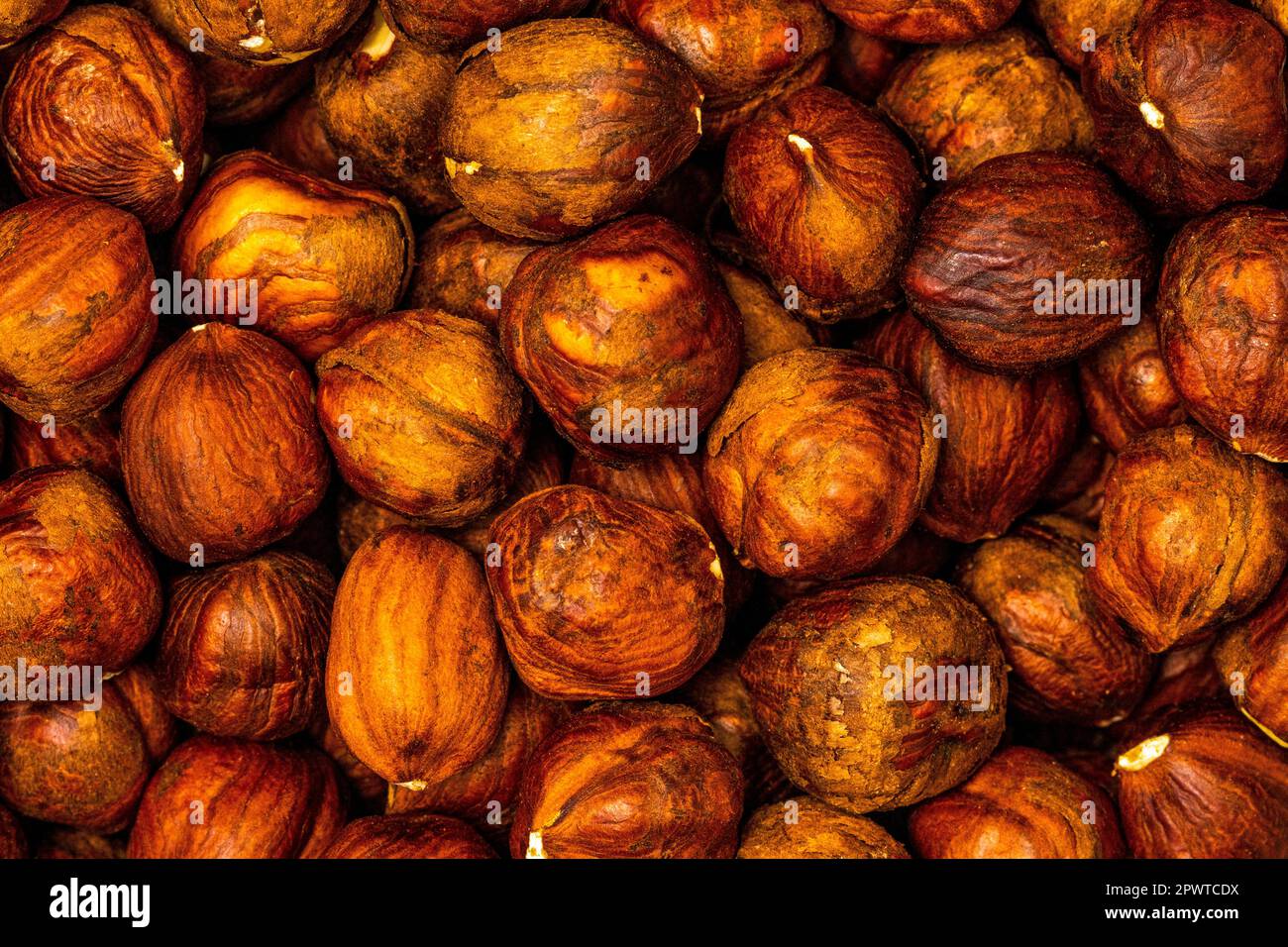 Hazelnut Background. Heap of peeled hazelnuts Stock Photo - Alamy