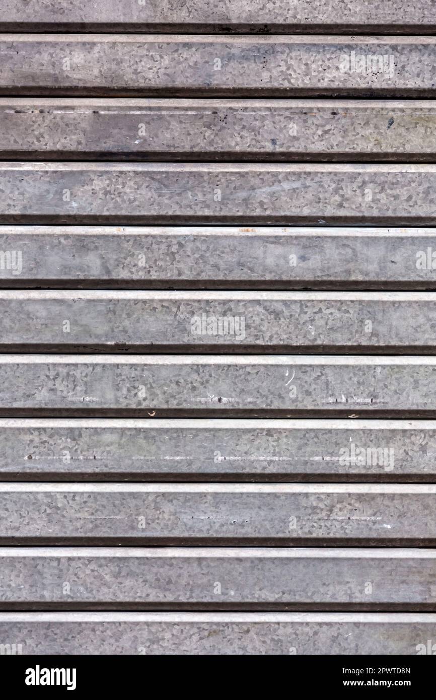 Grunge metal garage door texture background, distressed fragment close ...