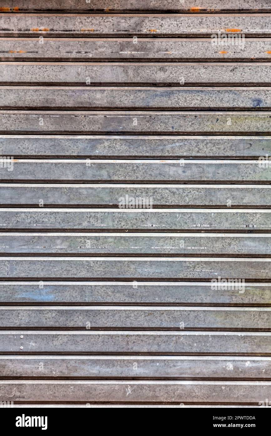 Grunge metal garage door texture background, distressed fragment close ...