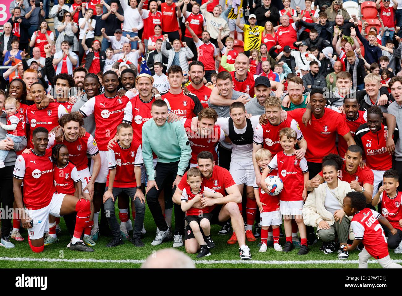 Rotherham United players all pose for a photo as they celebrate after ...