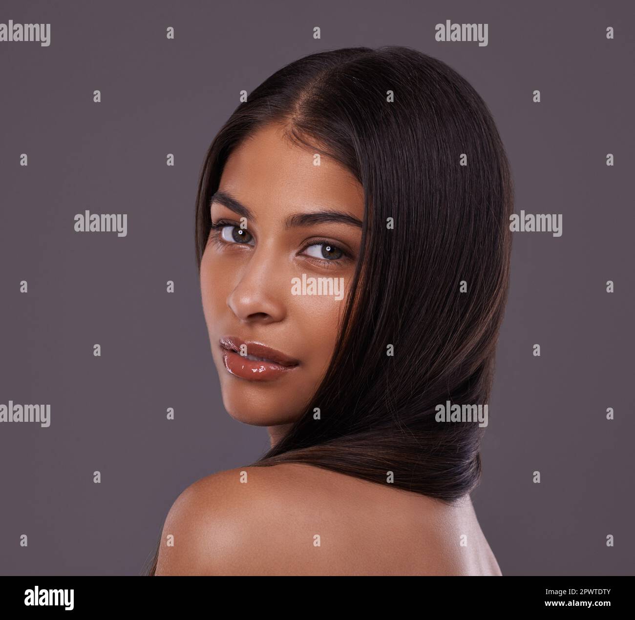 Shes got an exotic appeal. Portrait of a beautiful young woman posing ...