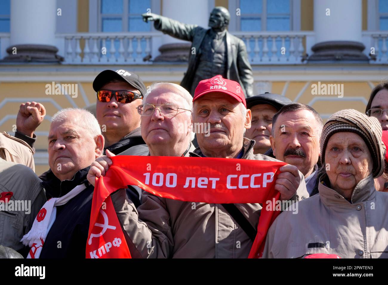 Communists party supporters gather near a statue of Soviet Union ...