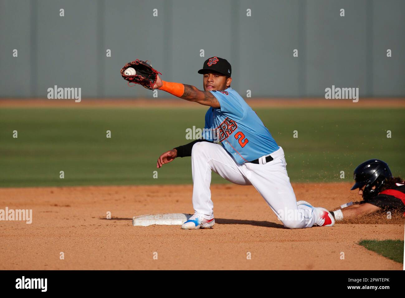 Second baseman Jeremy Arocho (2) of the Inland Empire 66ers reaches for ...