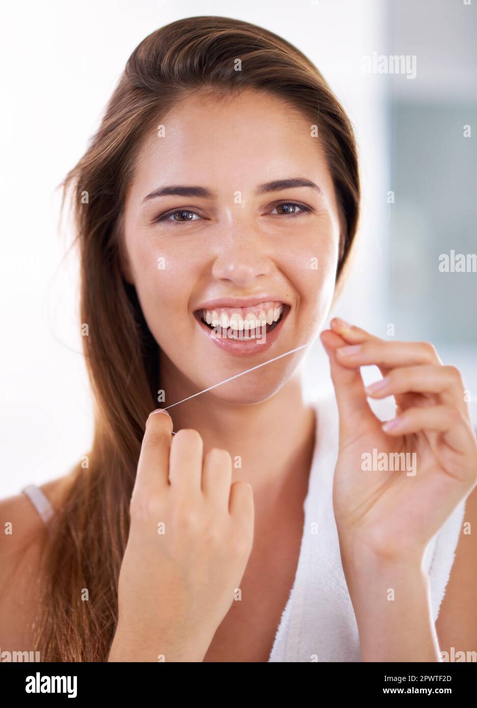 She knows the importance of flossing. Portrait of an attractive young ...