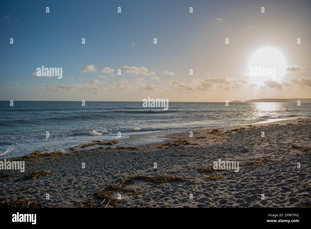 Evening Spring Sunset over the water at Downderry Beach in Cornwall ...