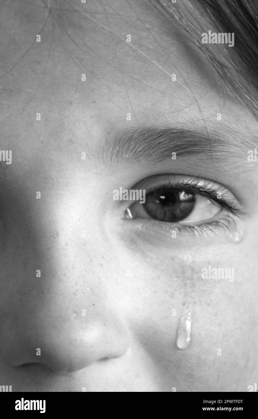 Girl crying with tears on face of cheek rolling down Stock Photo - Alamy