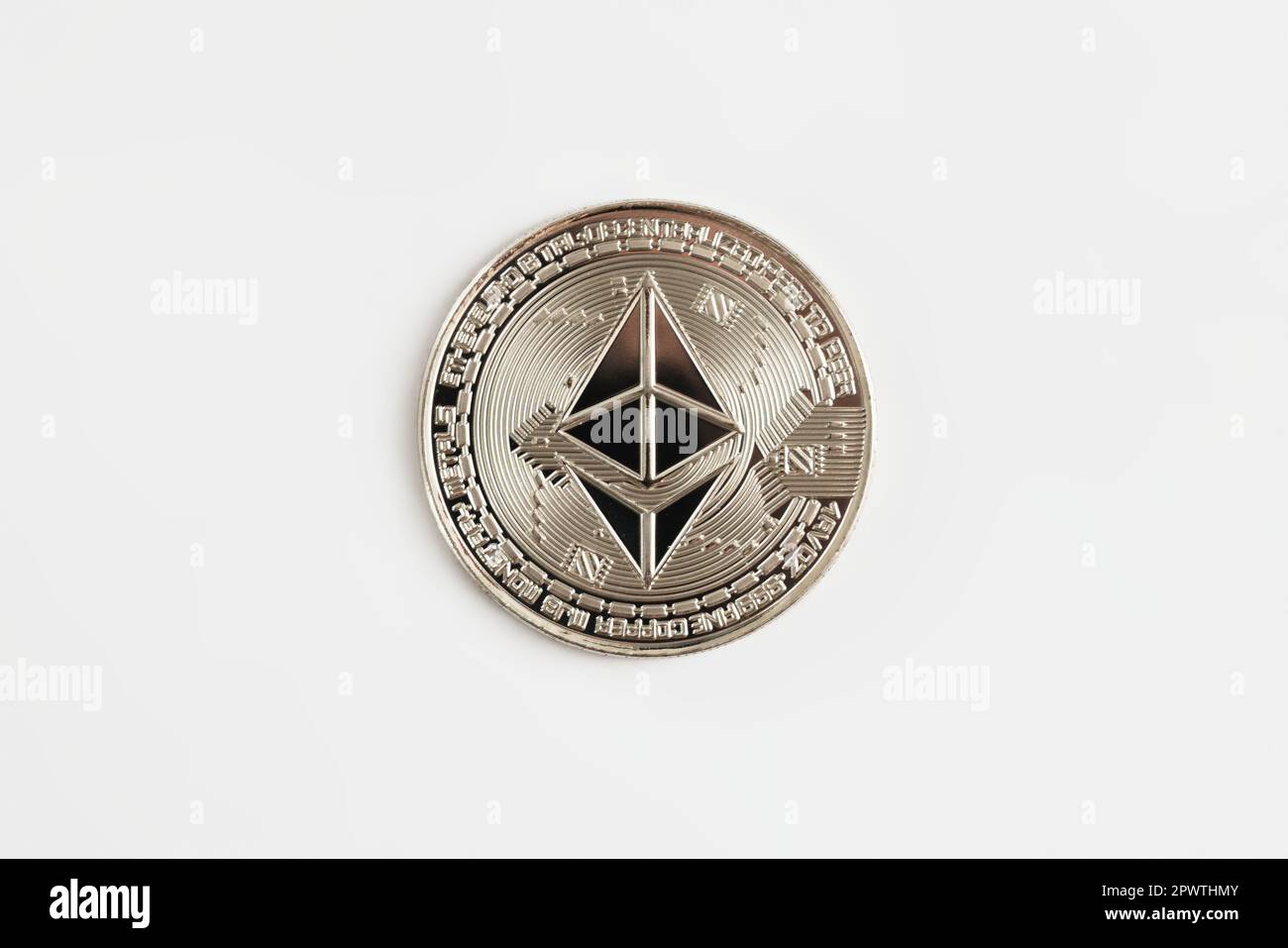 Silver physical Ethereum coin on white background. Digital currency ...