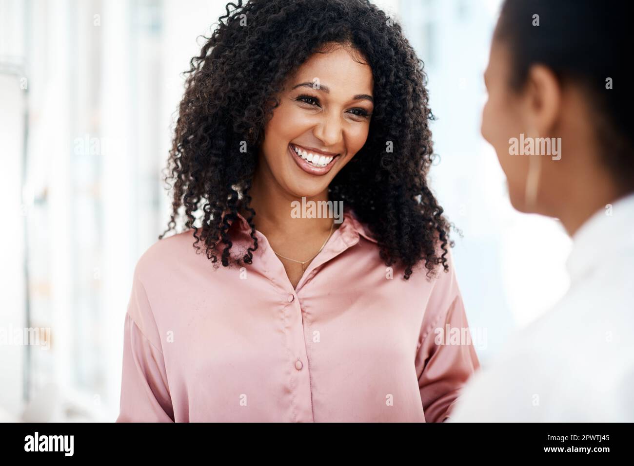 Start a dialogue and get to know your colleagues. two young ...