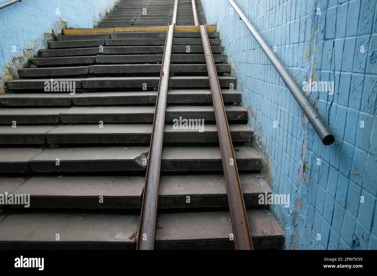 an old broken staircase up with a metal ramp Stock Photo - Alamy