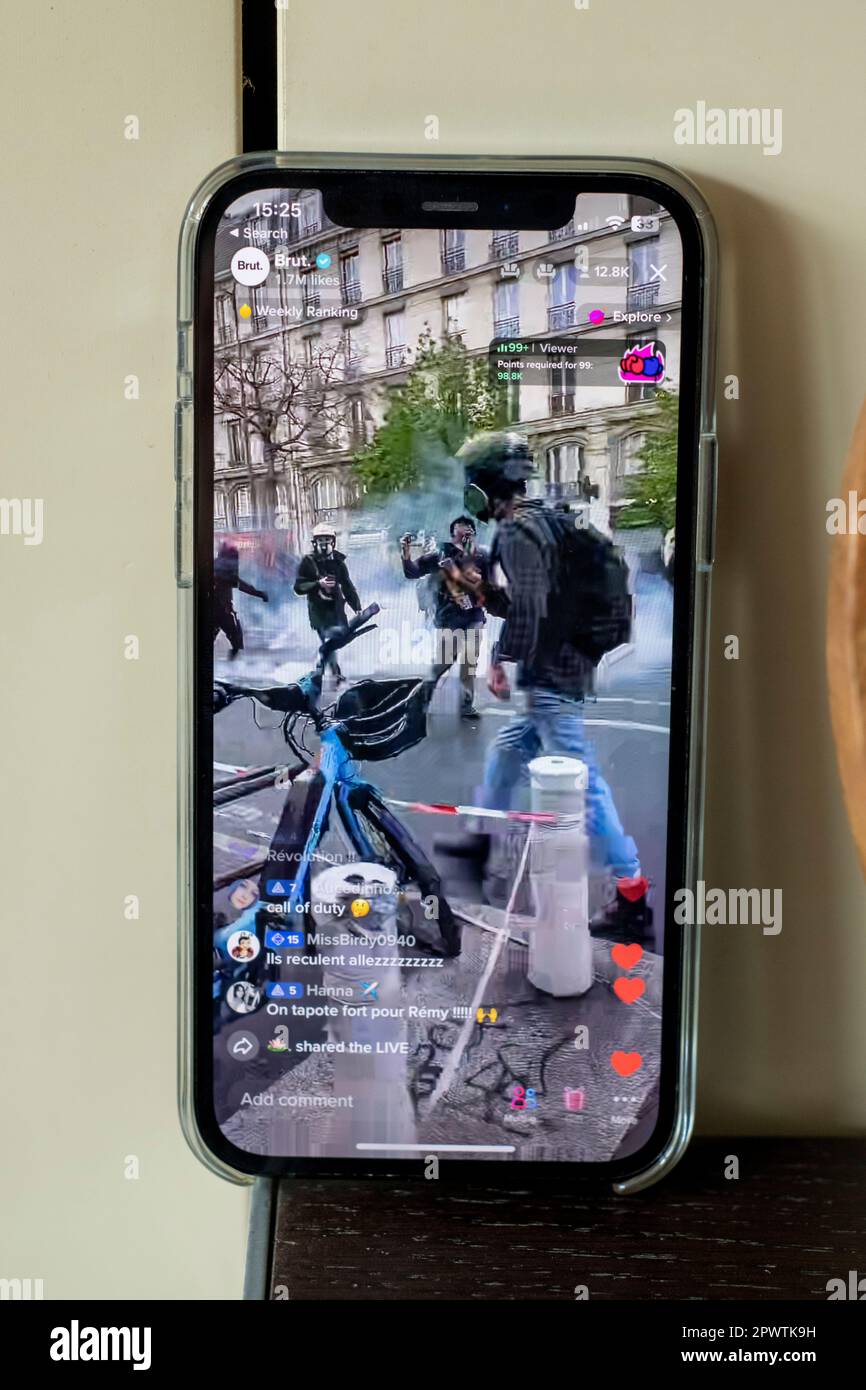 Pictures of an iphone12 live streaming the chaotic scenes at the riots in Paris on the 1st of ...