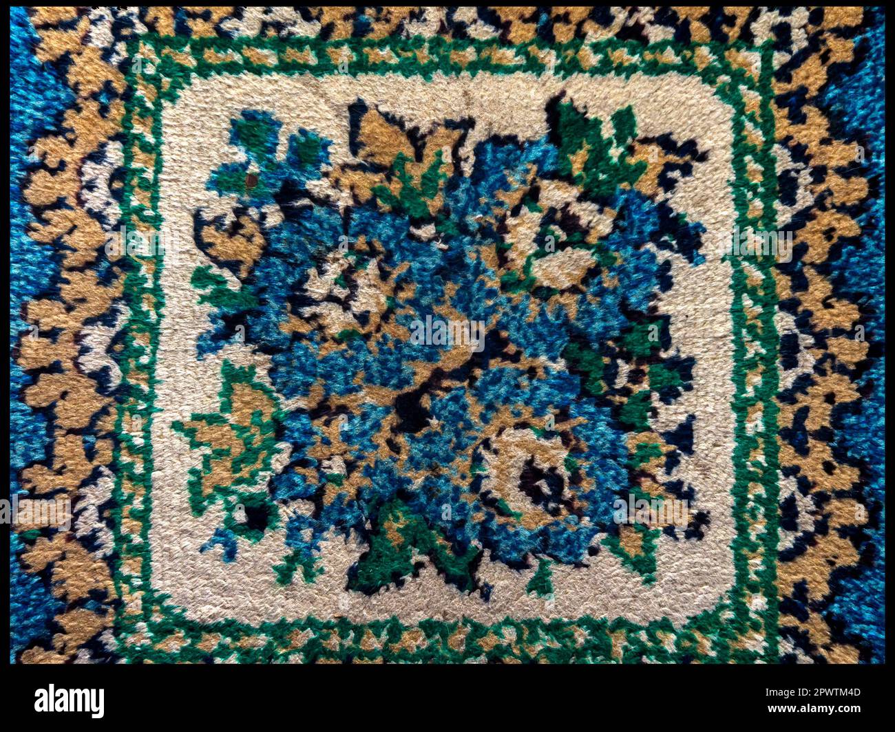 Colored carpet on a black background Stock Photo - Alamy