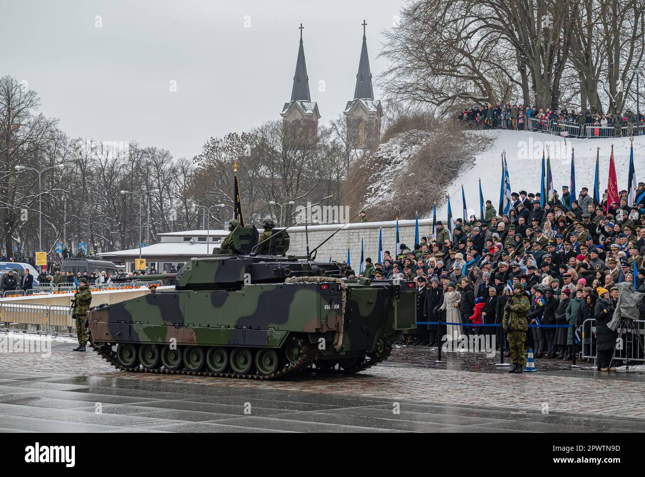 A crowd watching an infantry fighting vehicle for transport known as ...