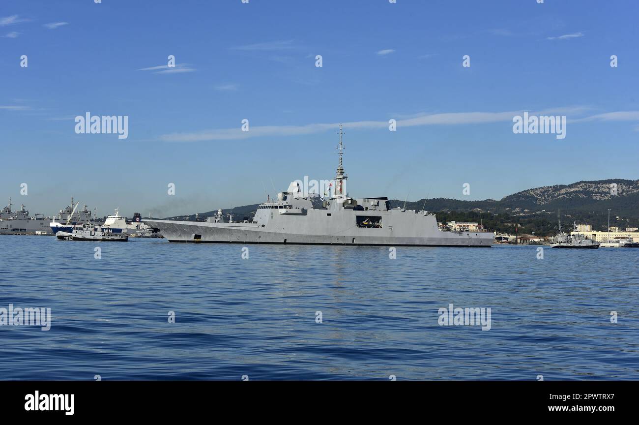 French Navy multi-mission frigate casting off in the harbor of Toulon ...
