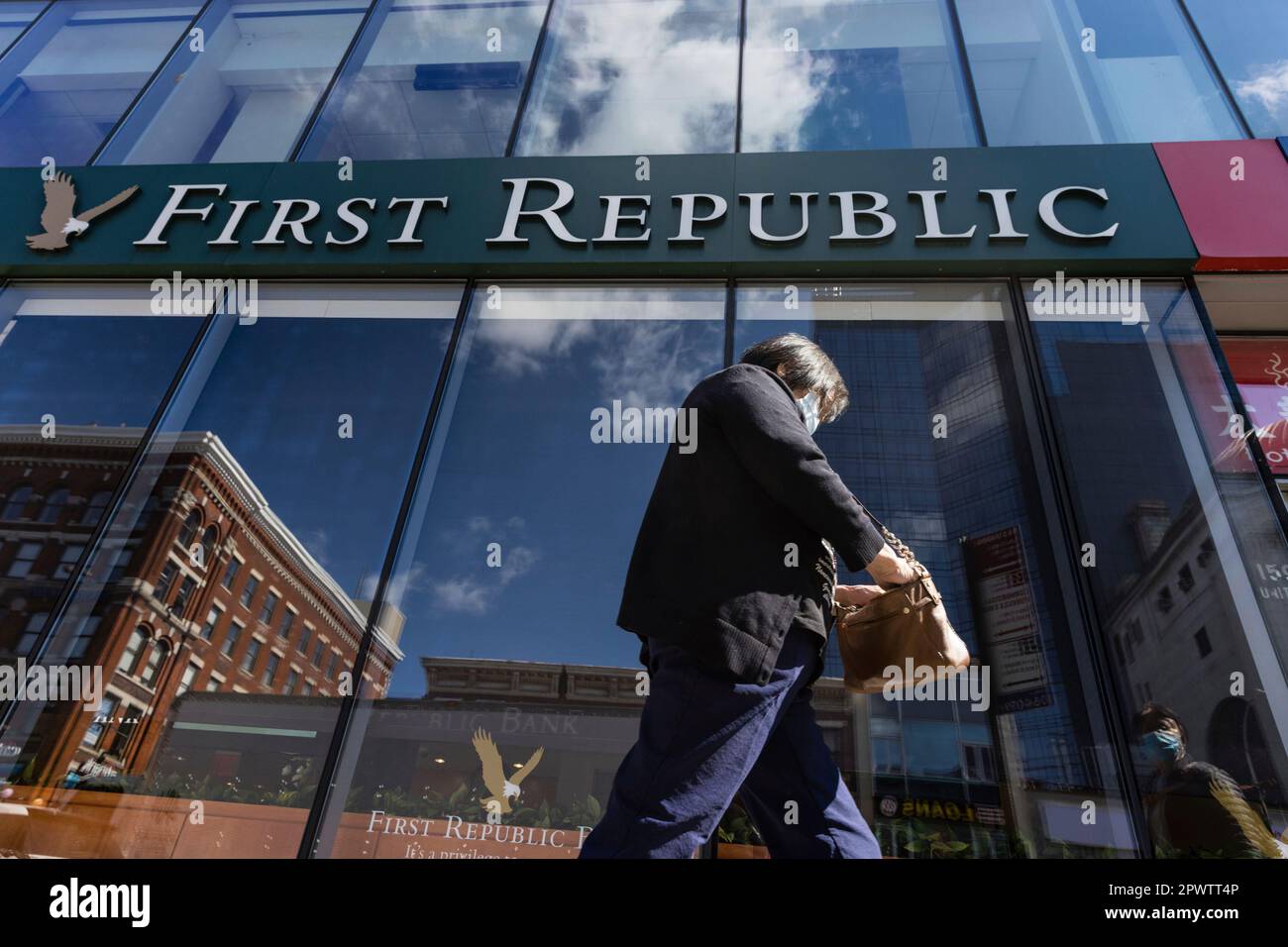 People walk by a First Republic Bank in New York, Monday, May 1, 2023 ...