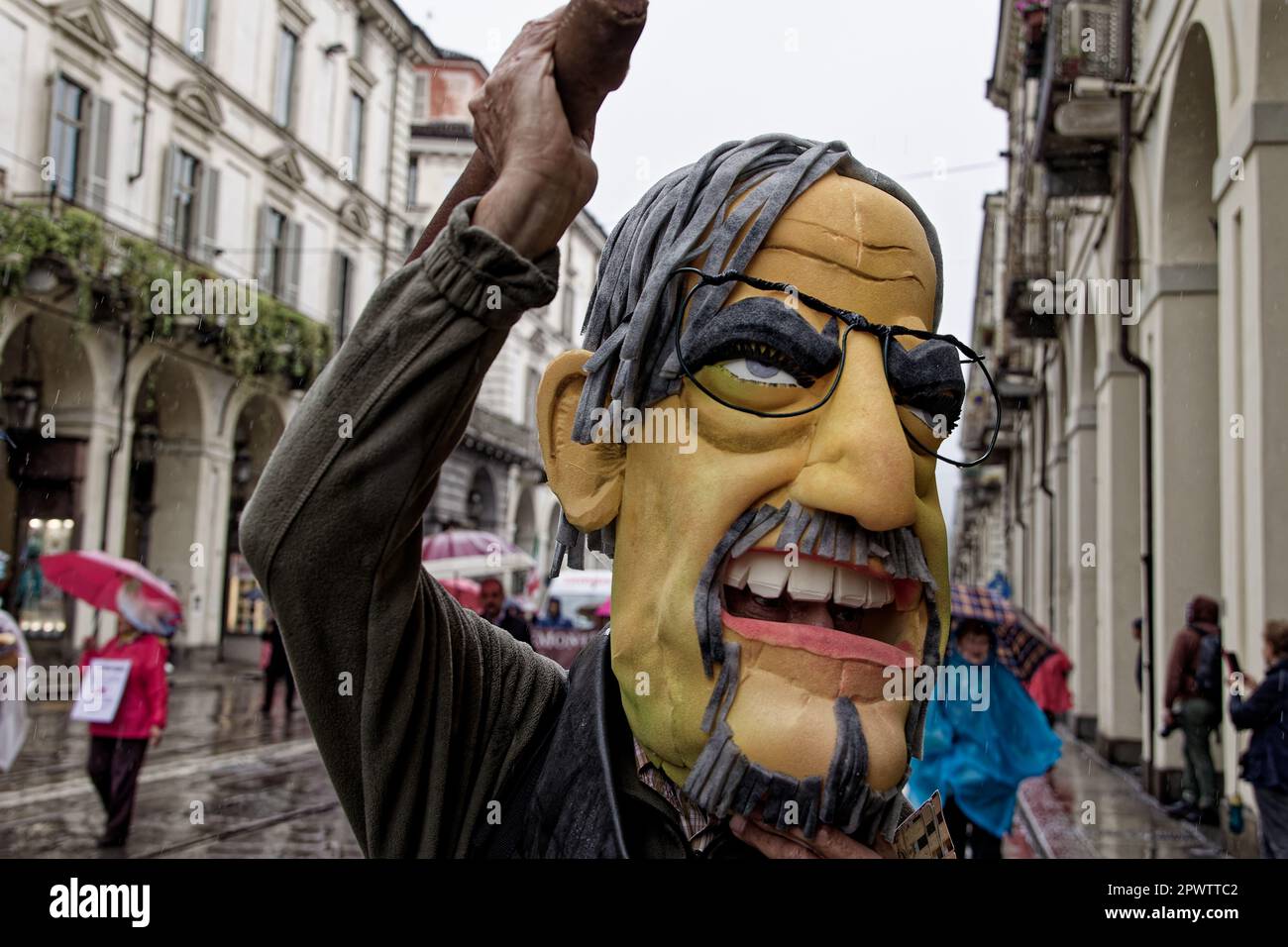 Turin, Italy. 1st May, 2023. A man wears a paper-mache head of the ...