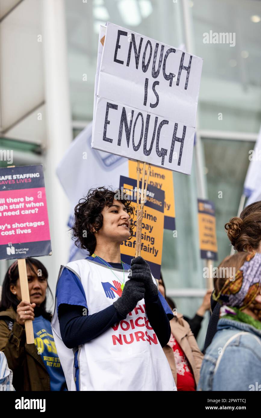 London, UK. 01st May, 2023. A nurse seen holding a placard at the ...