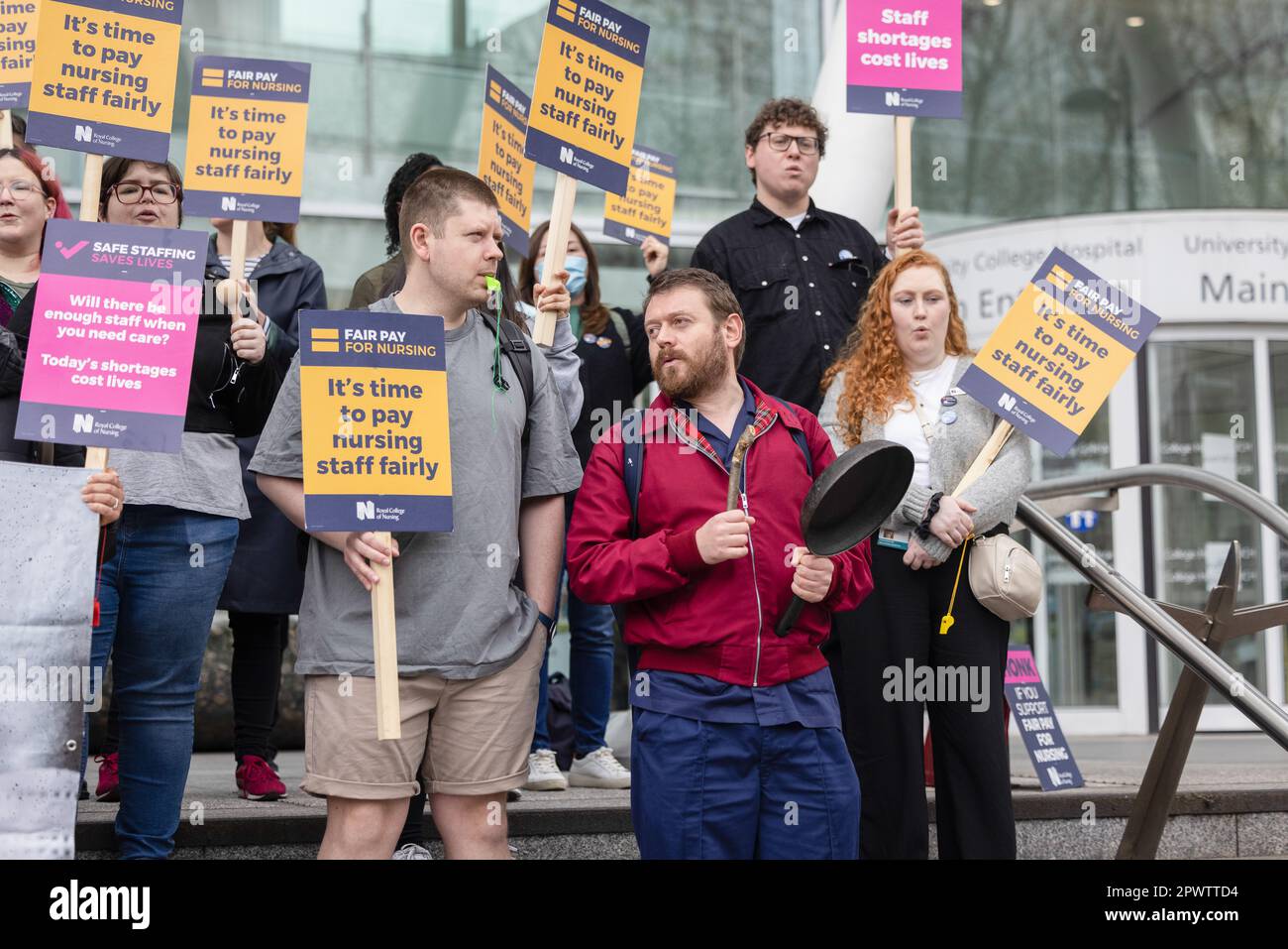 London, UK. 01st May, 2023. Nurses are seen holding placards at the ...