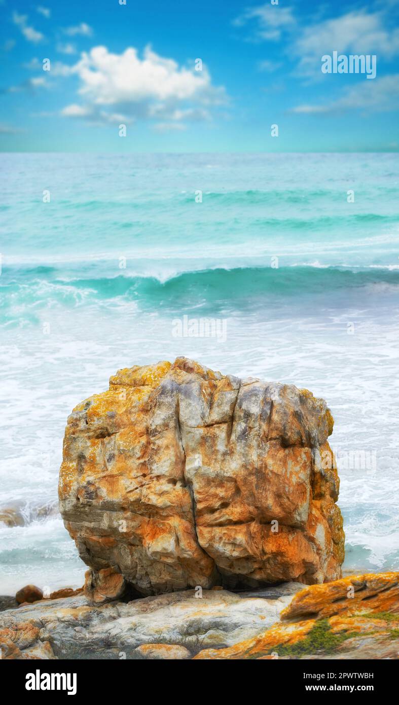 Set against the mighty oceans. A single rock set against a oceanic ...