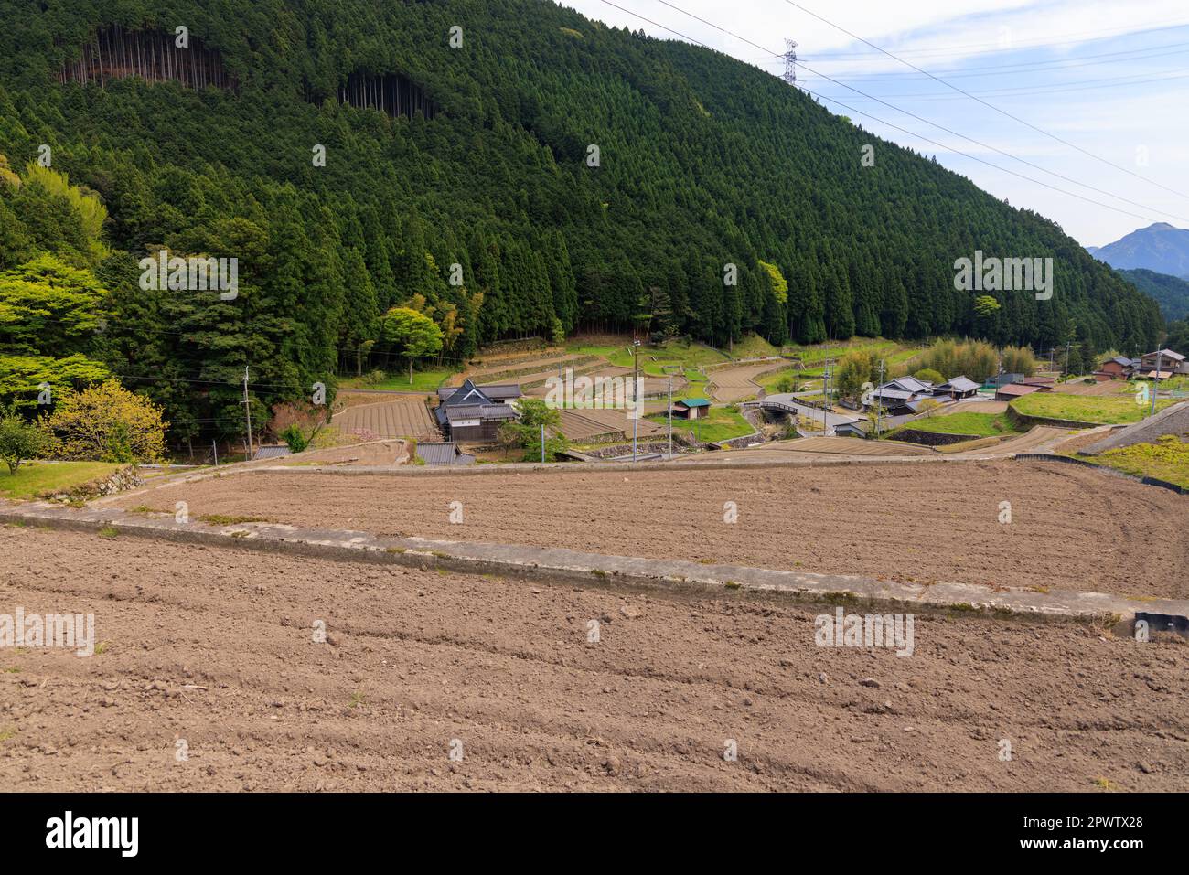 Dry soil in terraced fields over small village in mountains of Japan ...