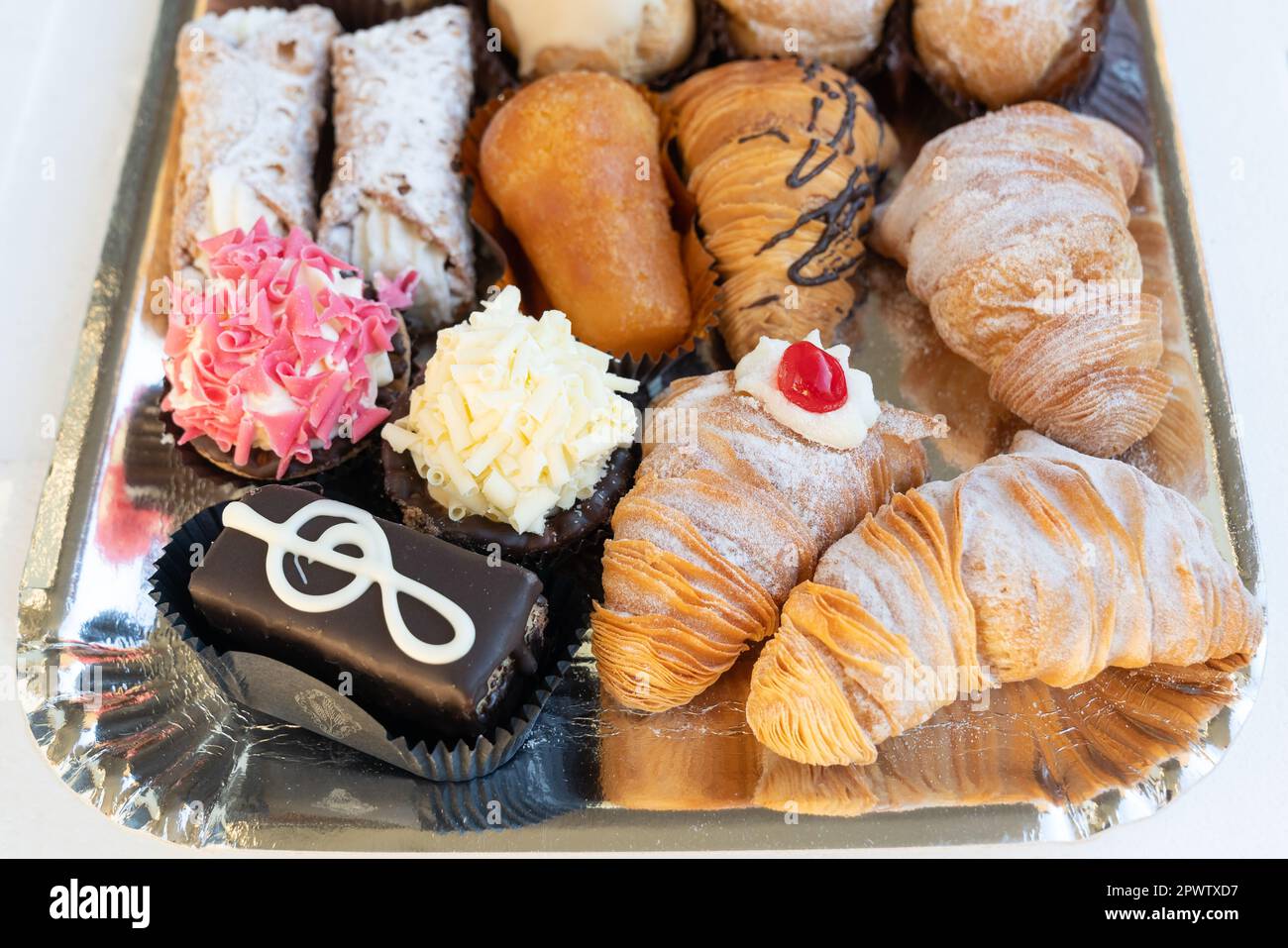 Assortment of delicious and colorful pastries, made by pastry chef. All ...