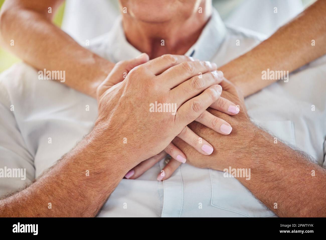 Closeup doctor holding hands on patients chest showing support during ...