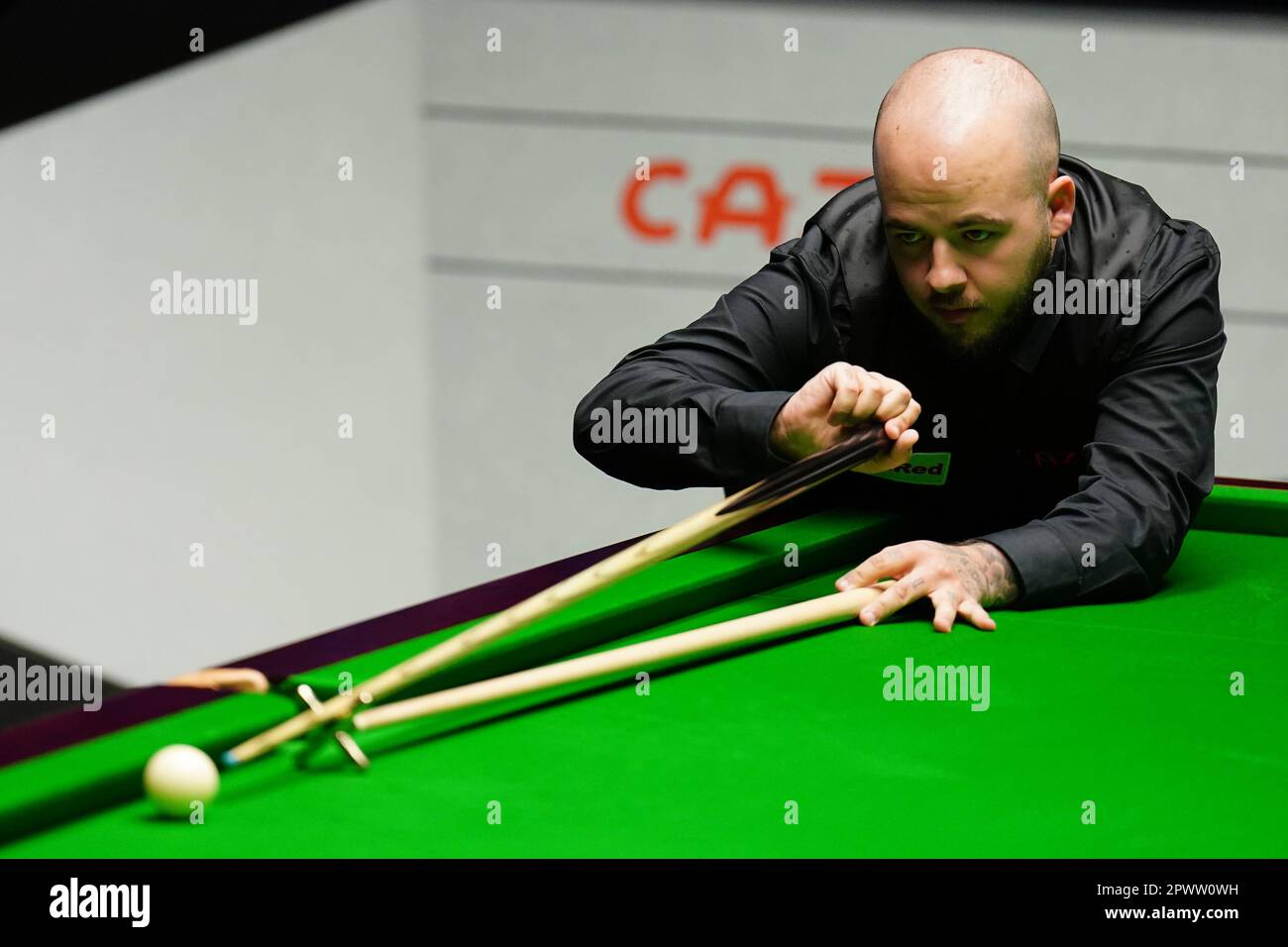 Luca Brecel in action against Mark Selby (not pictured) during the ...