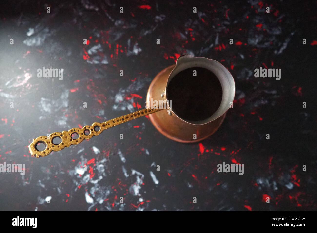 Balkan cezve for turkish coffee. A copper cezve on black surface ...