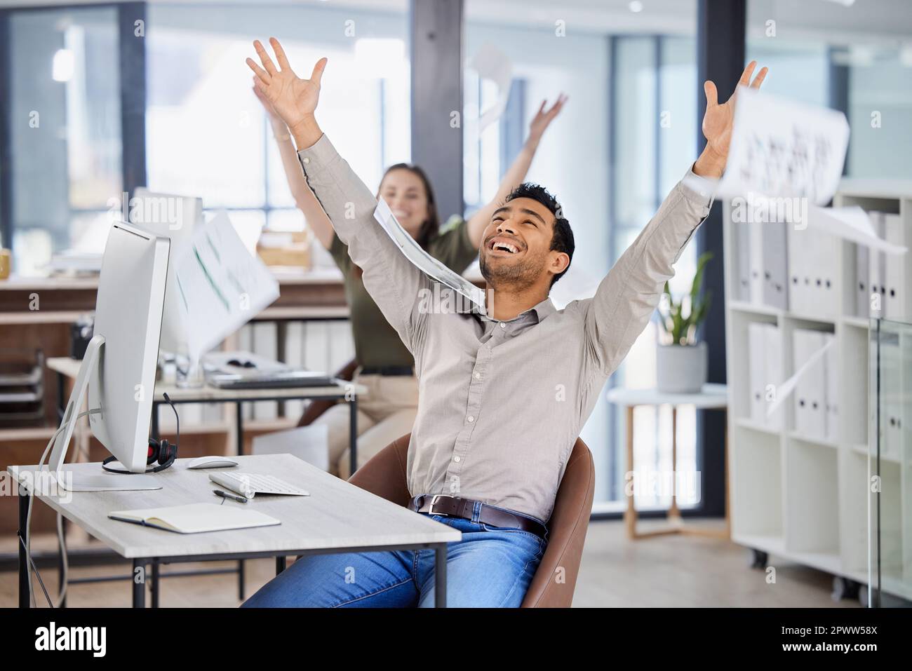 Its time to party. two colleagues celebrating the end of a shift at a ...