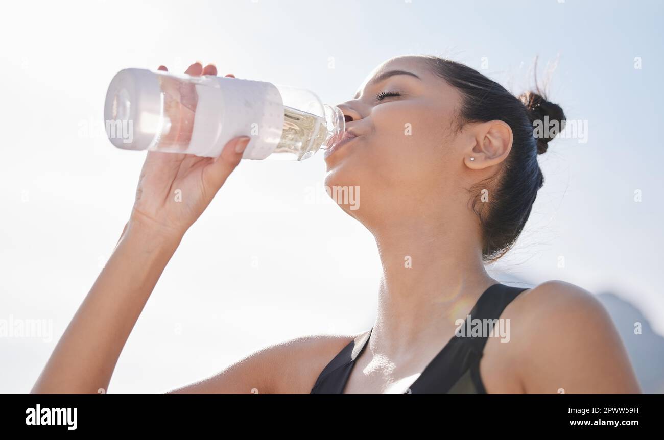 Drink more water, your body will thank you for it. a young woman ...