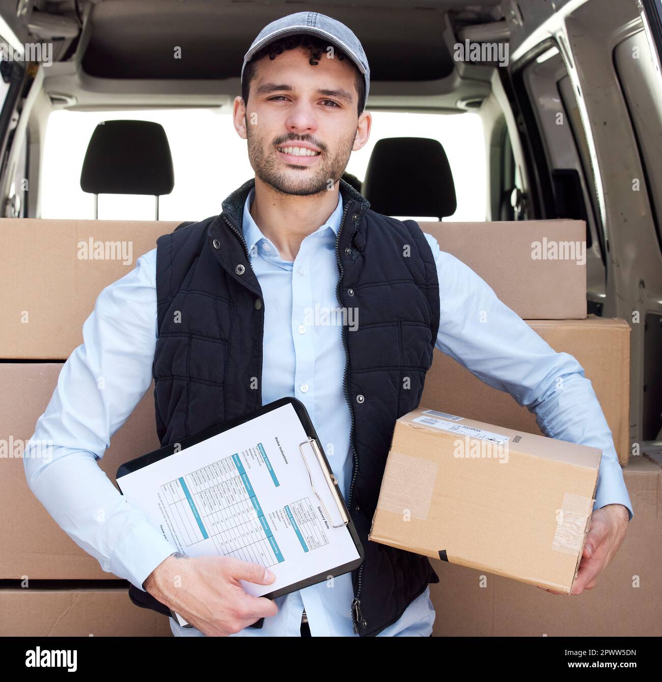 Were rated top in the industry. Portrait of a young delivery man ...