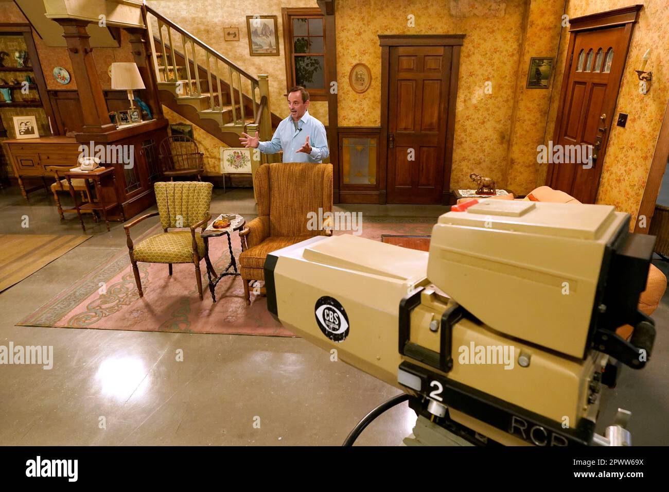 James Comisar responds to questions during an interview as he stands ...