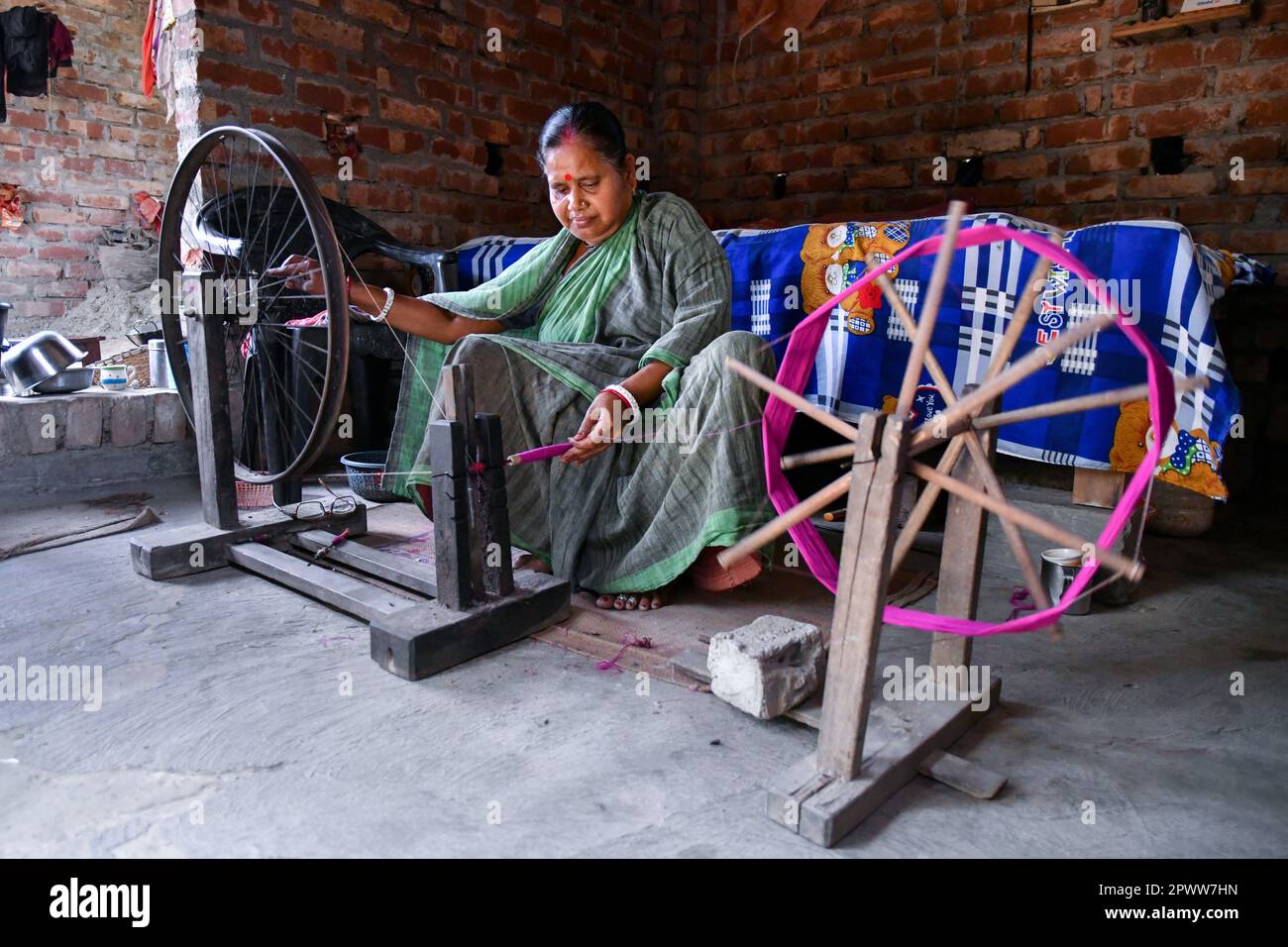 Kolkata, India. 5th Apr, 2023. A woman seen weaving using a traditional ...