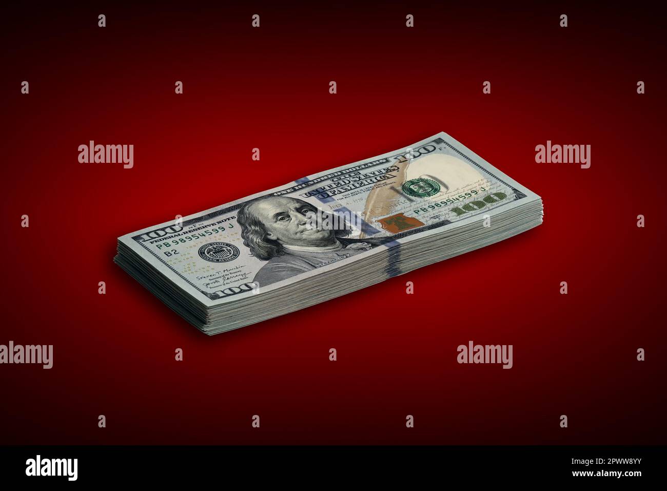 Bundle of US dollar bills on crimson red background. Pack of american ...