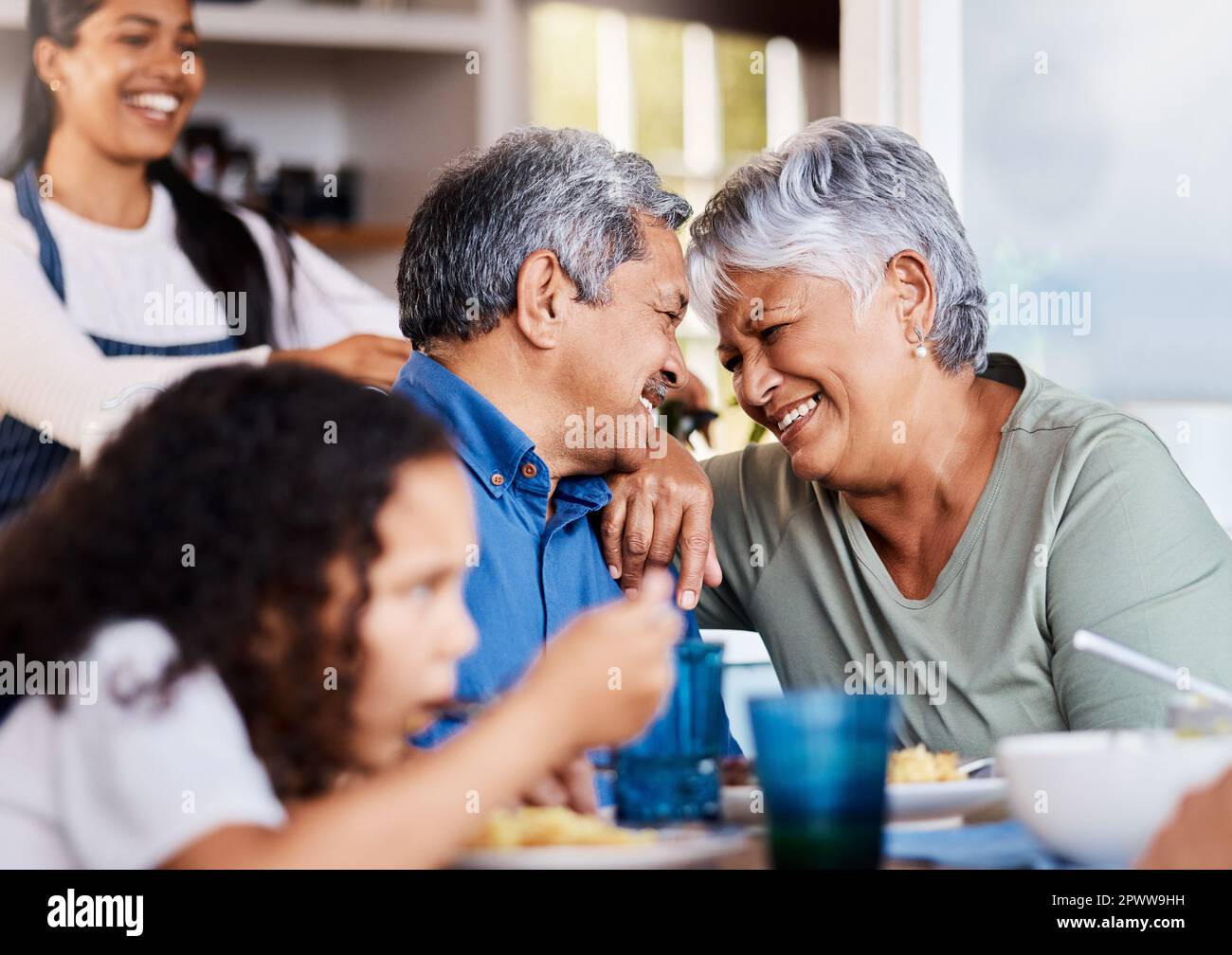 The life we built. a happy family having lunch together at home Stock ...