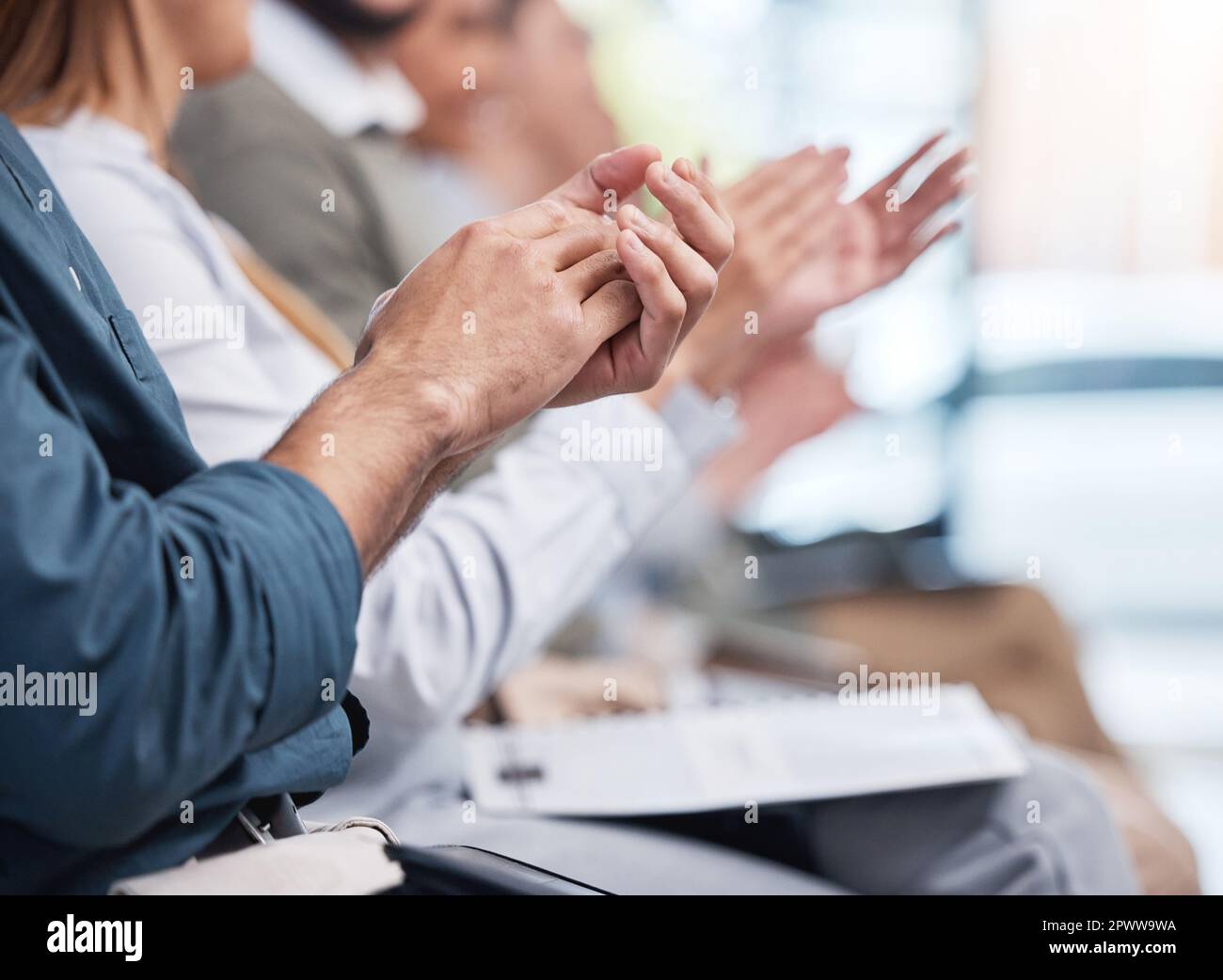 Unknown group of diverse businesspeople clapping in office training ...