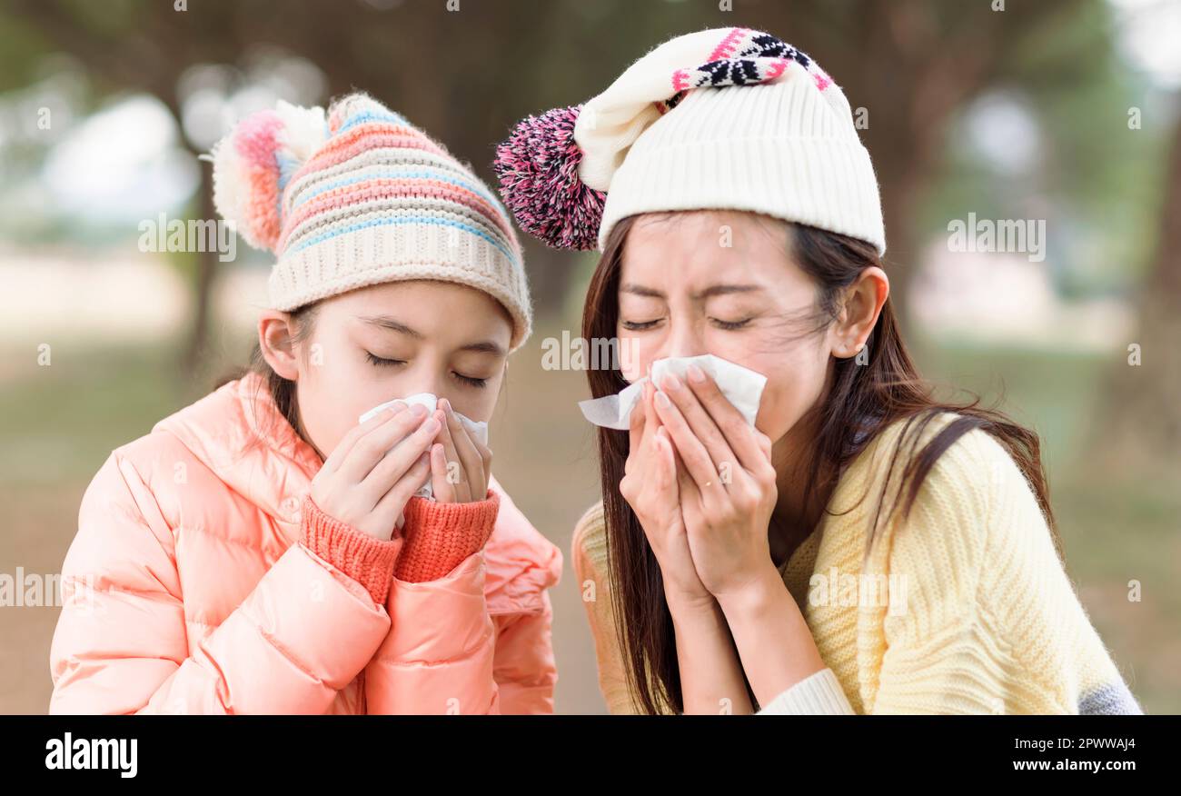 Mother and daughter having running noses Stock Photo - Alamy