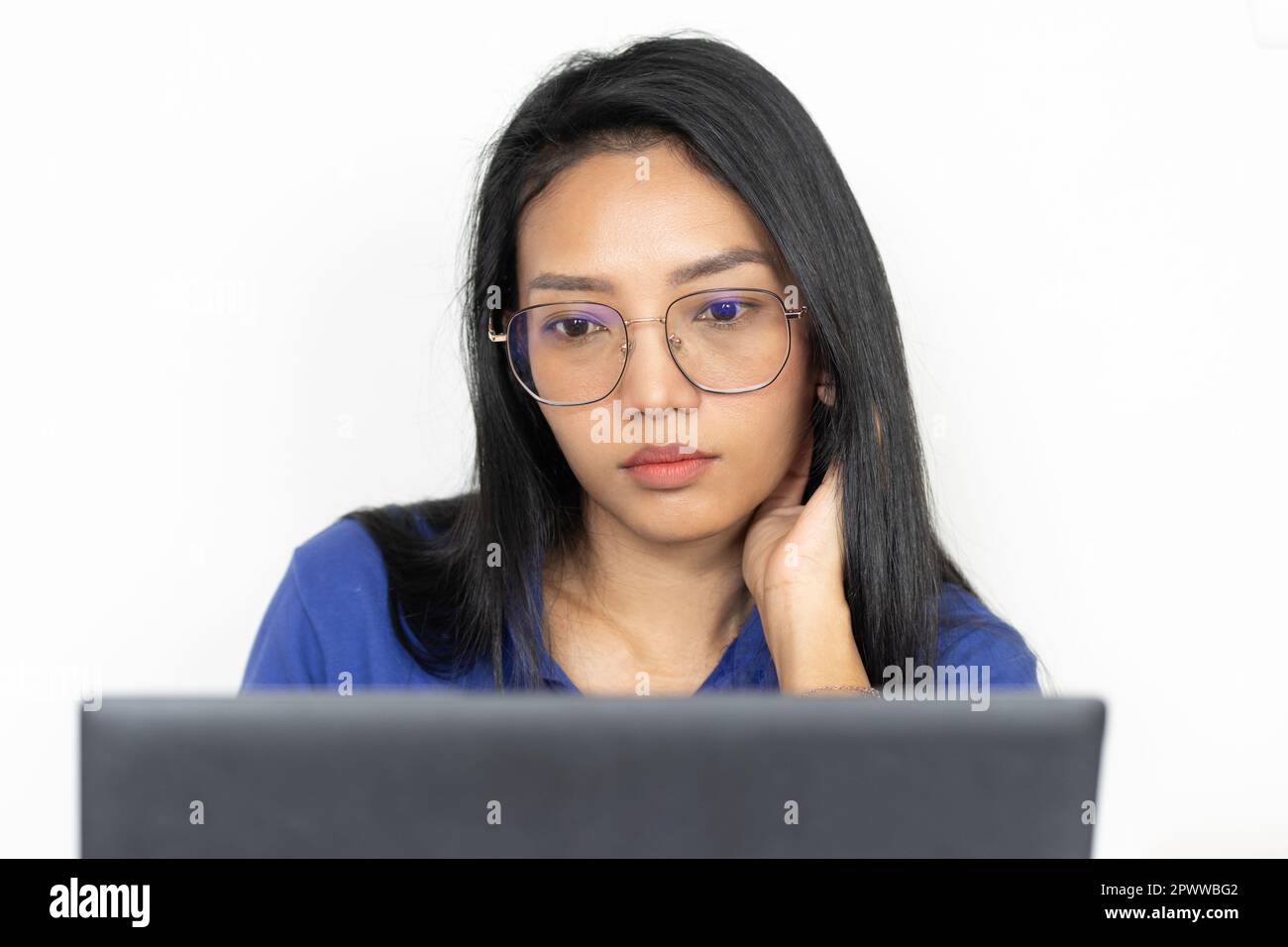 A young woman watch display of laptop with hand on a her head Stock ...