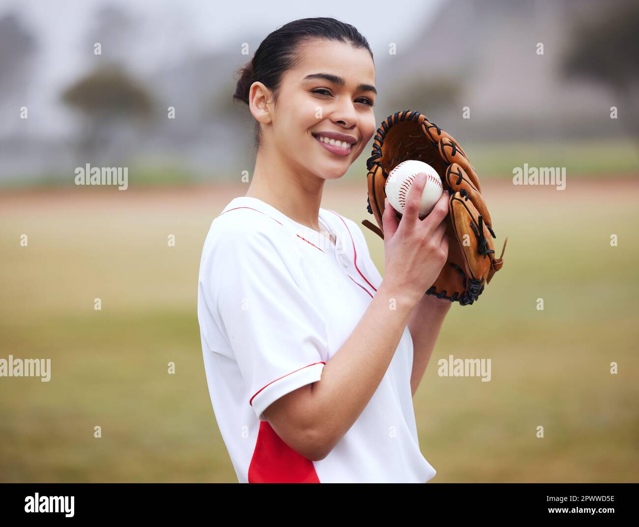 Ready. Cropped portrait of an attractive young female baseball player ...