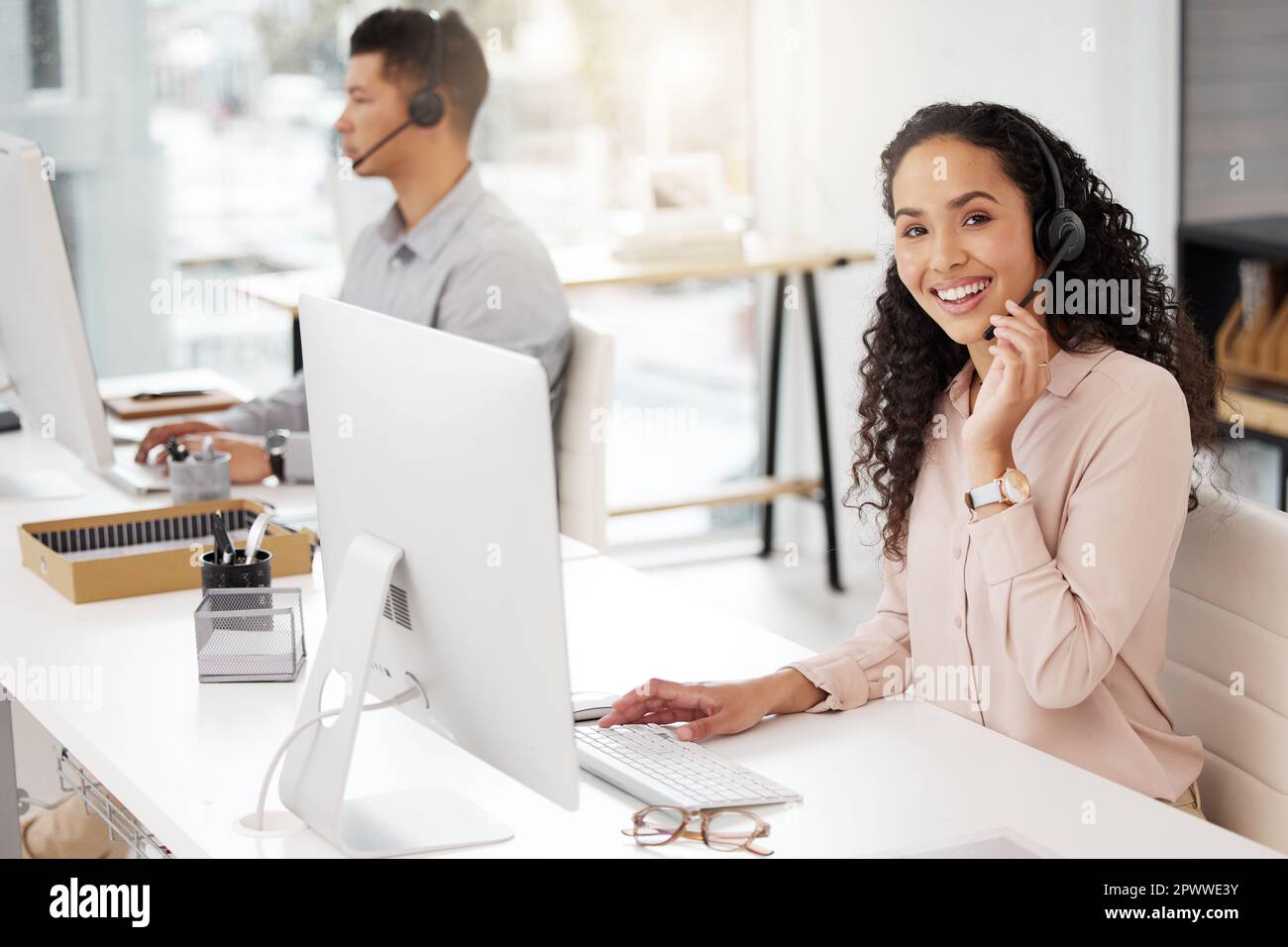 Female worker helping another worker hi-res stock photography and ...