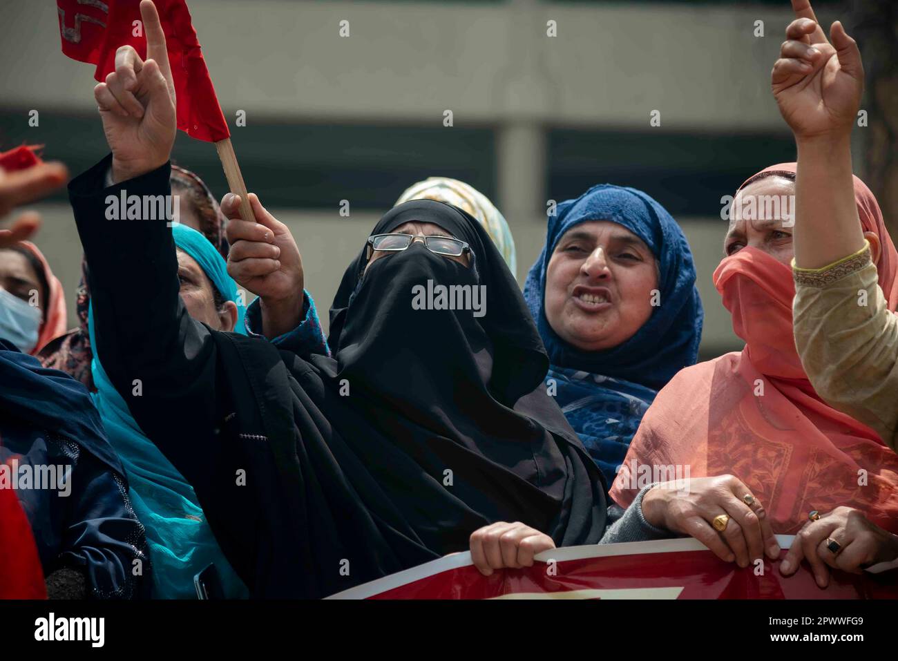 Contractual and Daily wage workers chant slogans during a protest ...