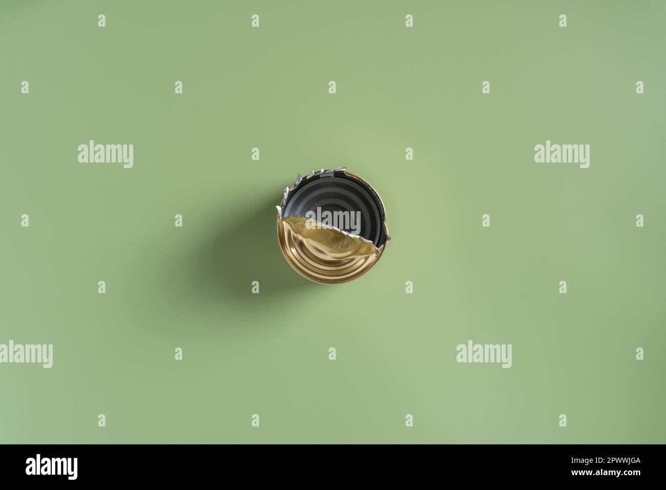 Metal canned jar with open cup on green background. Green strategy ...