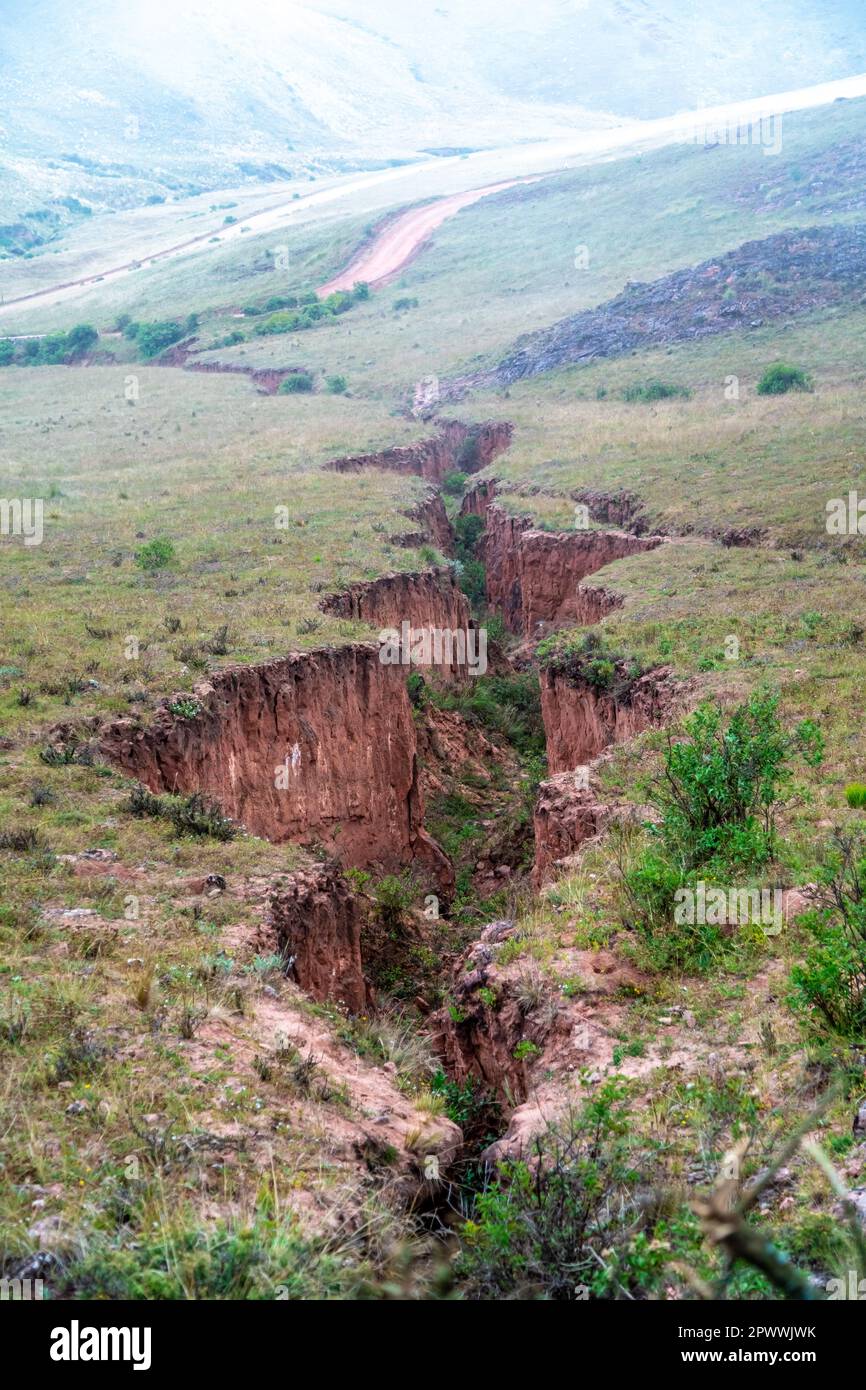 a large crack in the ground after seismic activity Stock Photo - Alamy