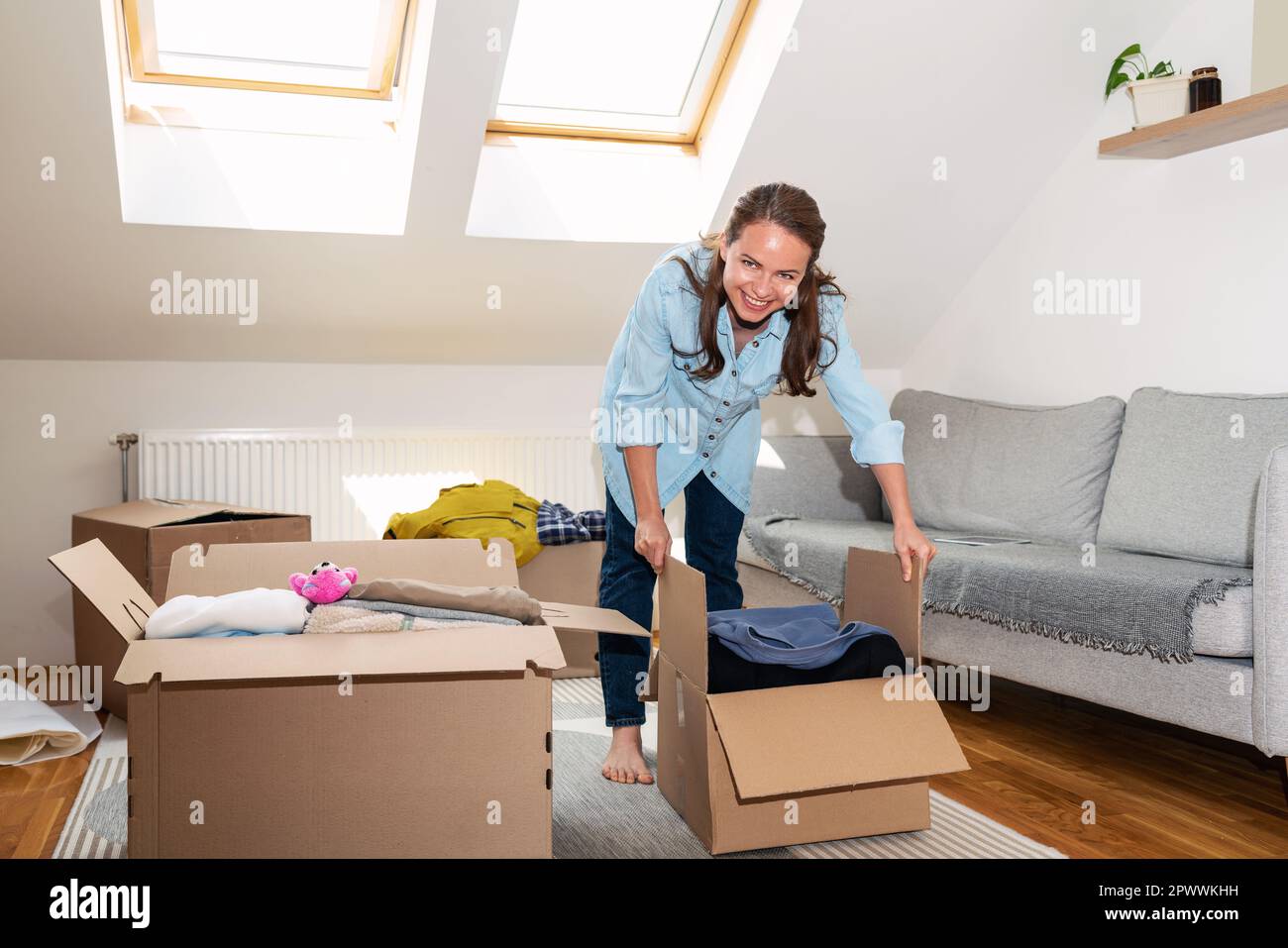 Unpacking delivery clothes hi-res stock photography and images - Alamy