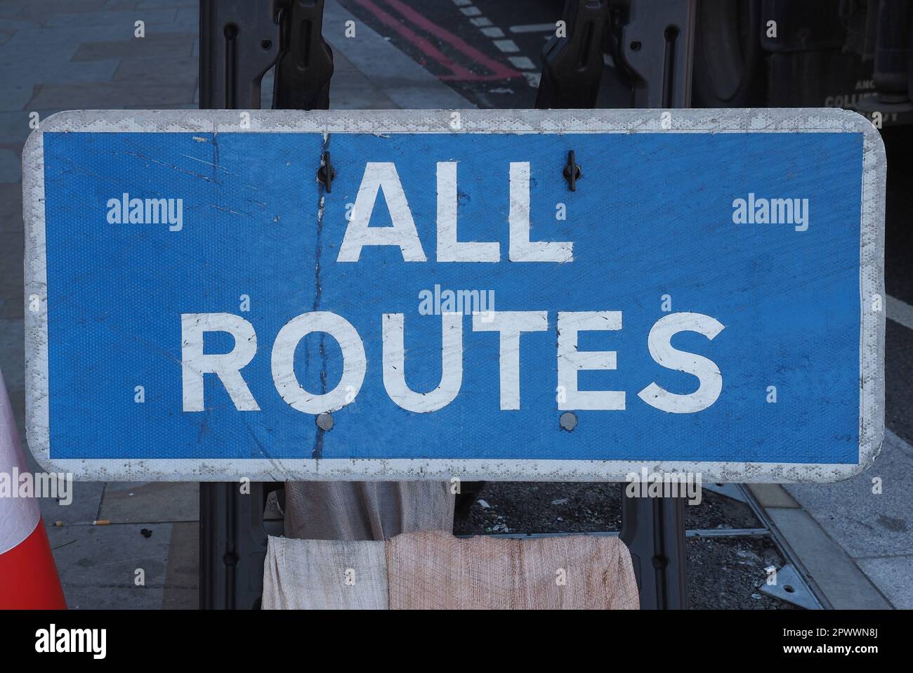 all routes direction sign in white over blue background Stock Photo - Alamy
