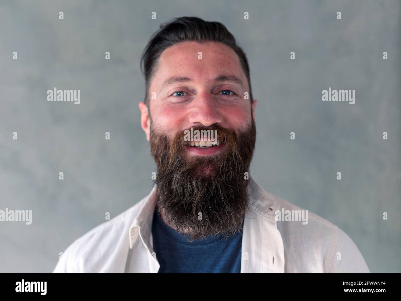Bearded man smiling posing hi-res stock photography and images - Alamy