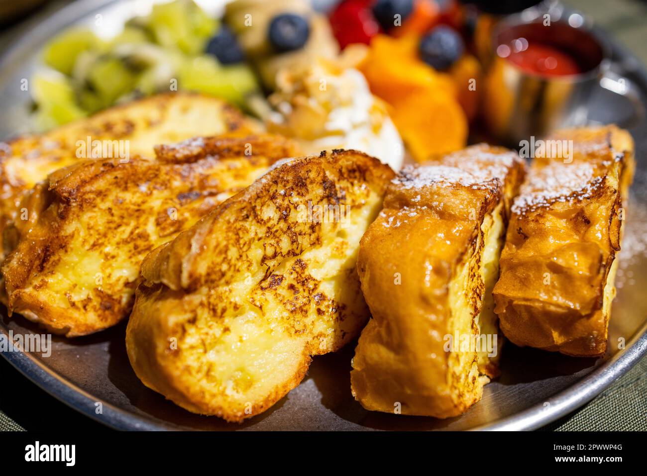 Grill toast with egg and fruit in coffee shop Stock Photo - Alamy