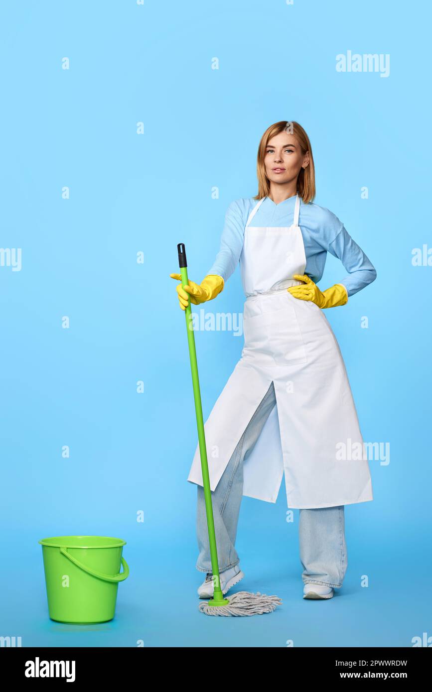 professional cleaner blonde woman in rubber gloves and cleaner apron ...